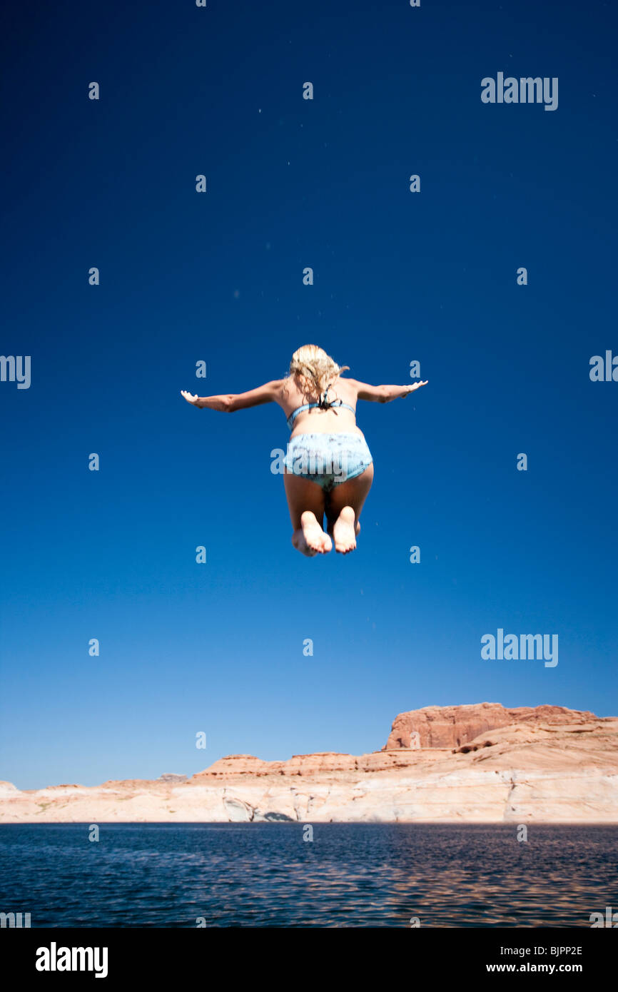 Rear view female leaping hi-res stock photography and images - Alamy