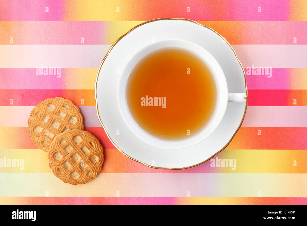 tea and cookie on color background Stock Photo - Alamy
