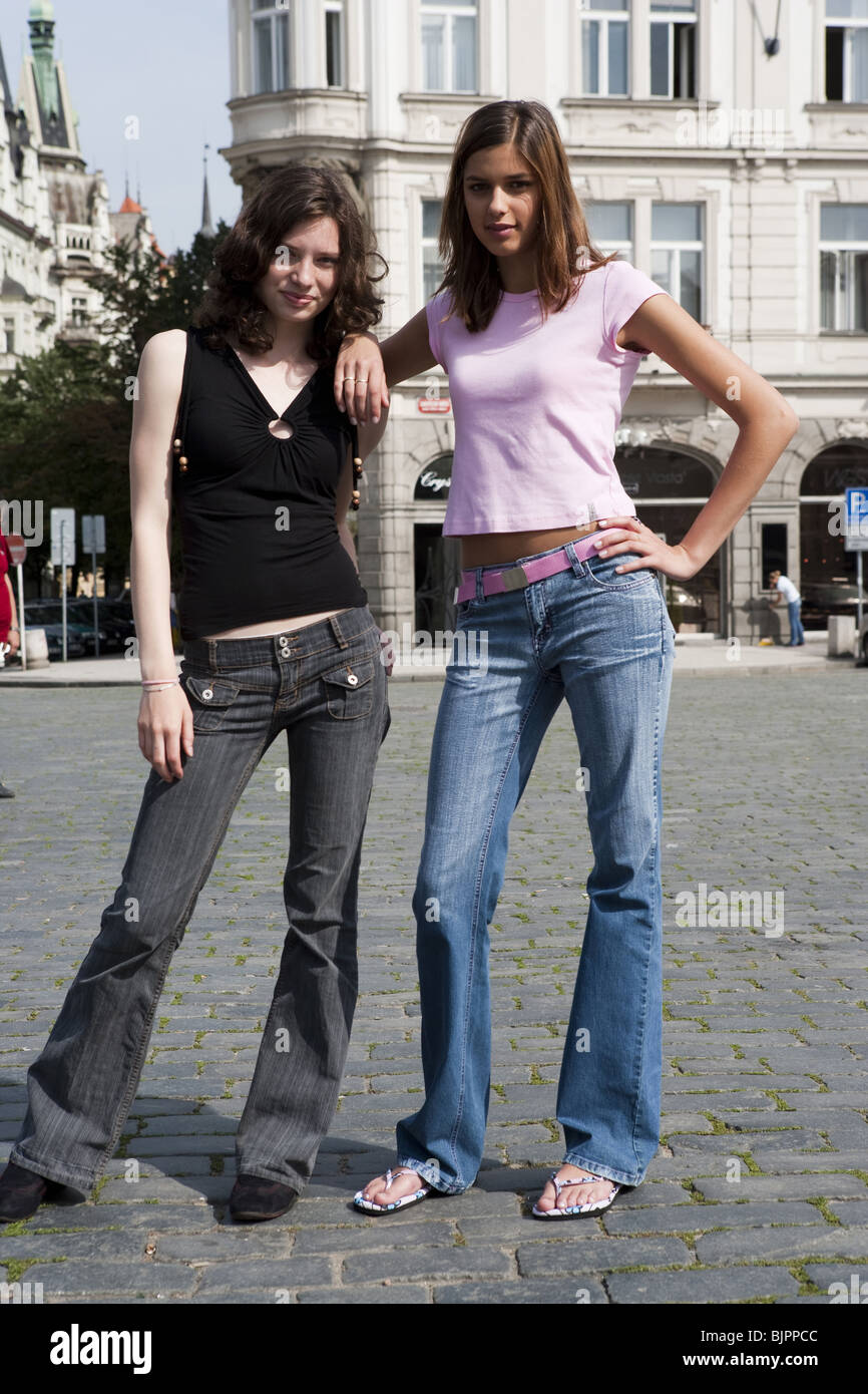 Two women standing in the street Stock Photo - Alamy