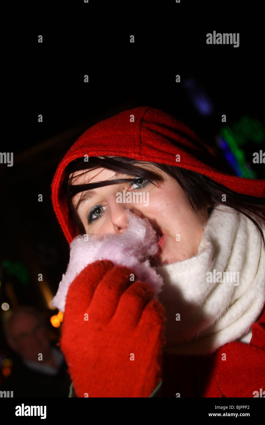 Teenage girl eating candy floss Stock Photo - Alamy