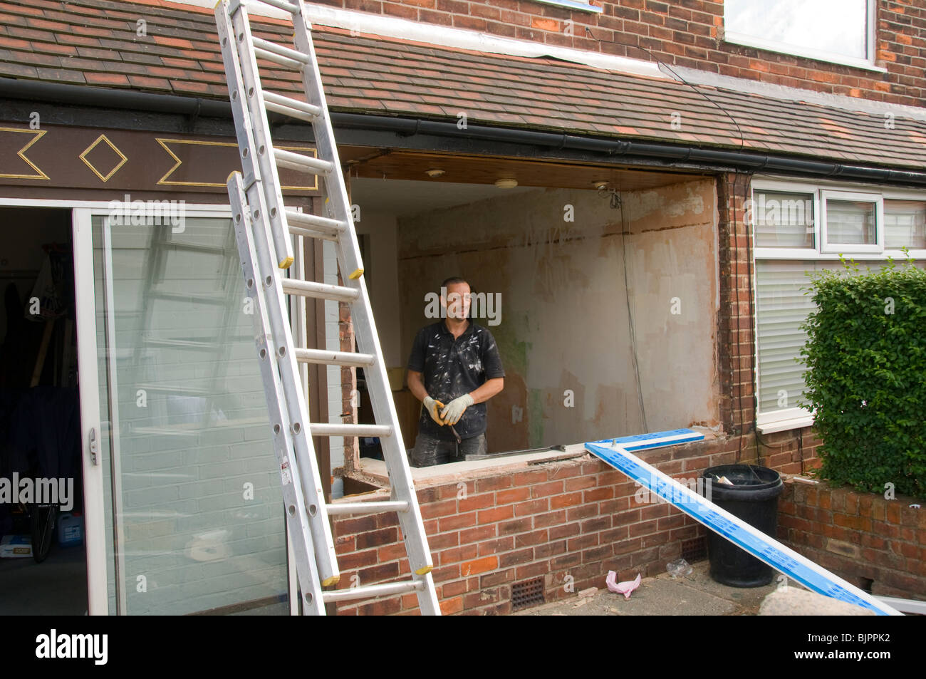 New uPVC windows being fitted to the front of a terraced house ...