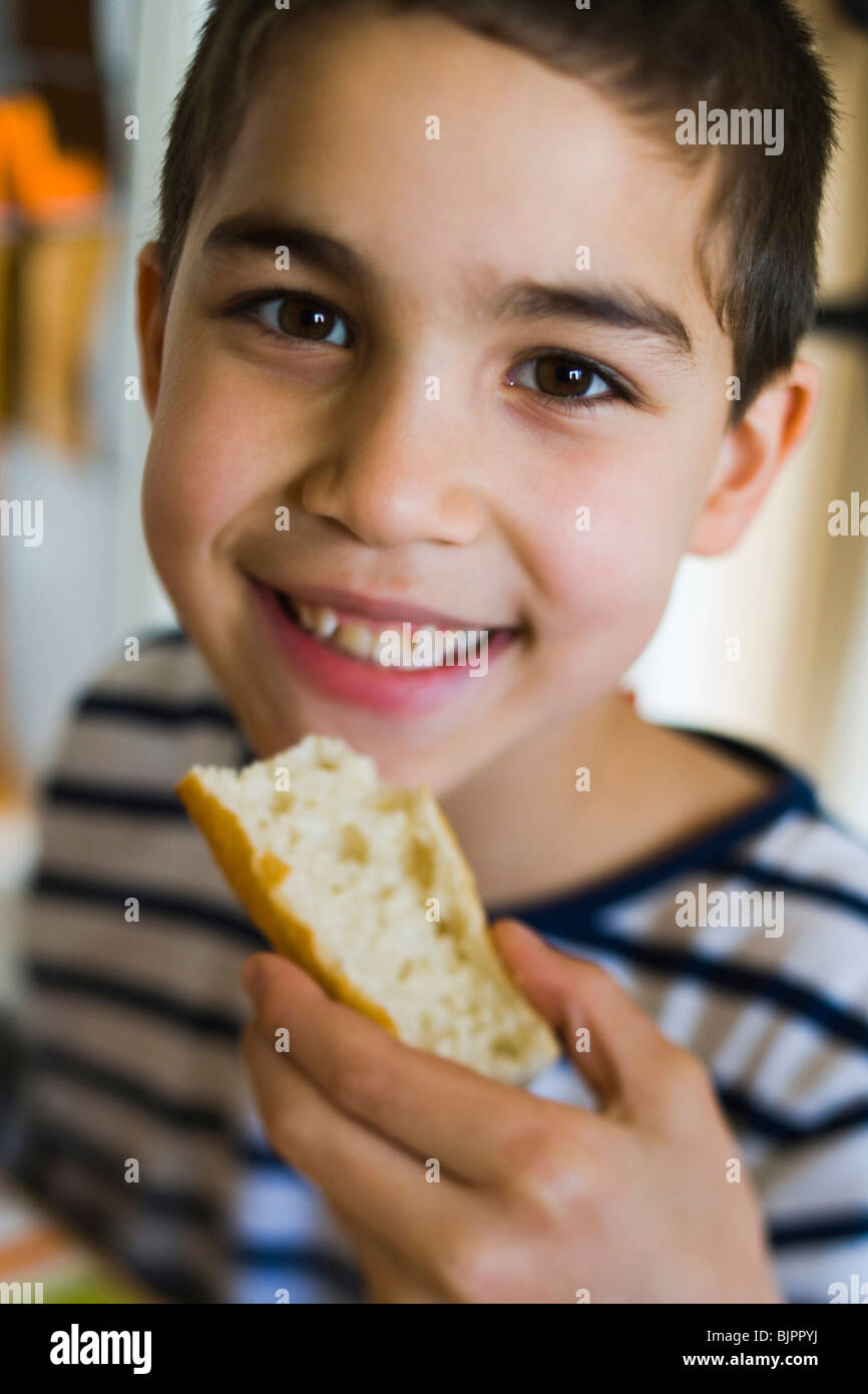 Boy with bread Stock Photo - Alamy