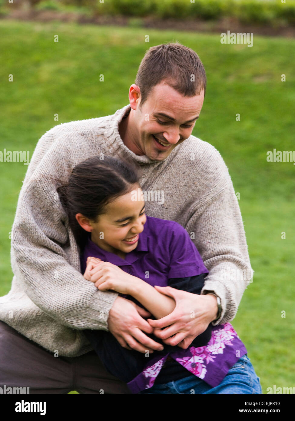 Father play fighting with daughter Stock Photo - Alamy