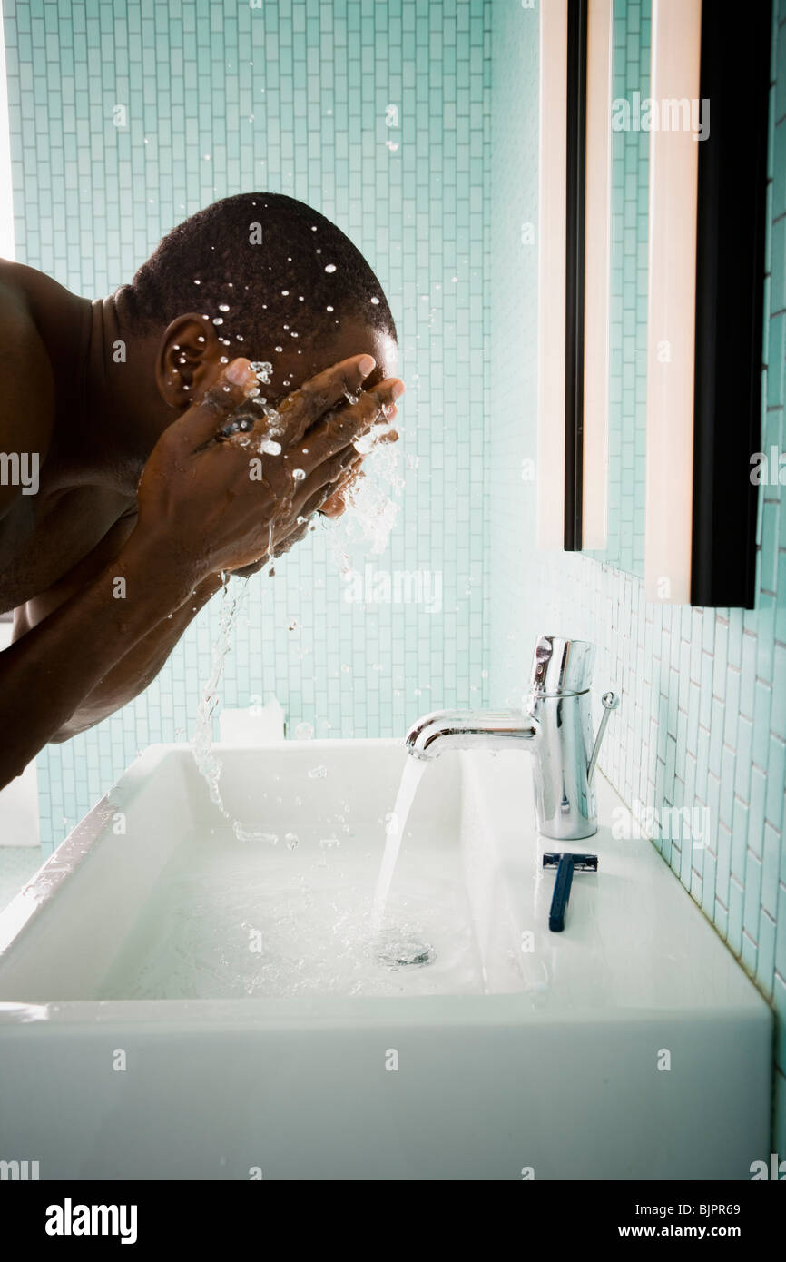 Male washing face Stock Photo - Alamy