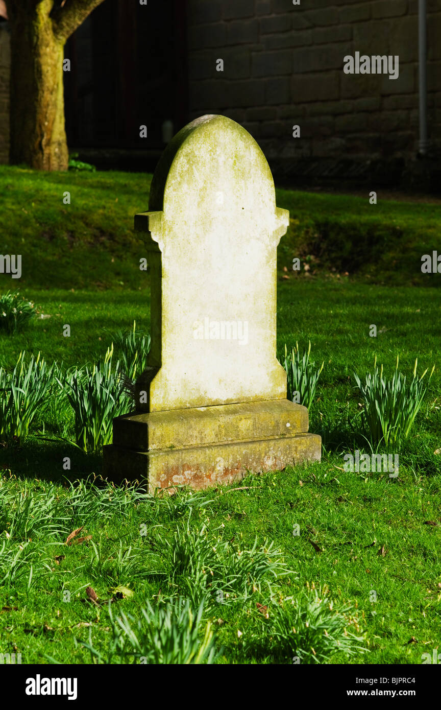 gravestones lit by the sun in a country cemetery Stock Photo - Alamy
