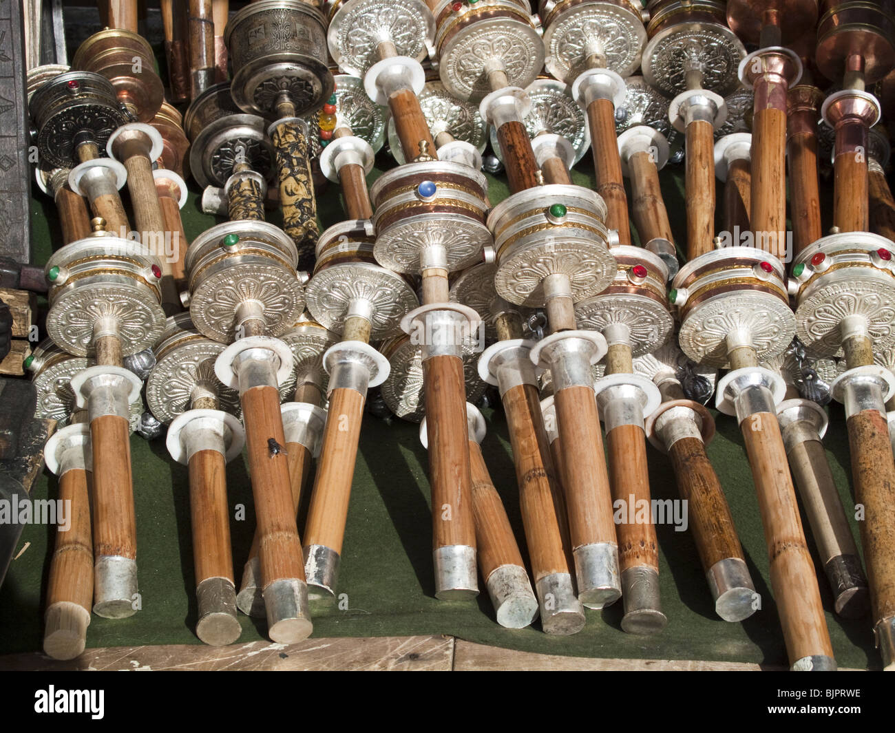 Prayer wheels in a stall in Barkhor Square, Lhasa, Tibet Stock Photo ...