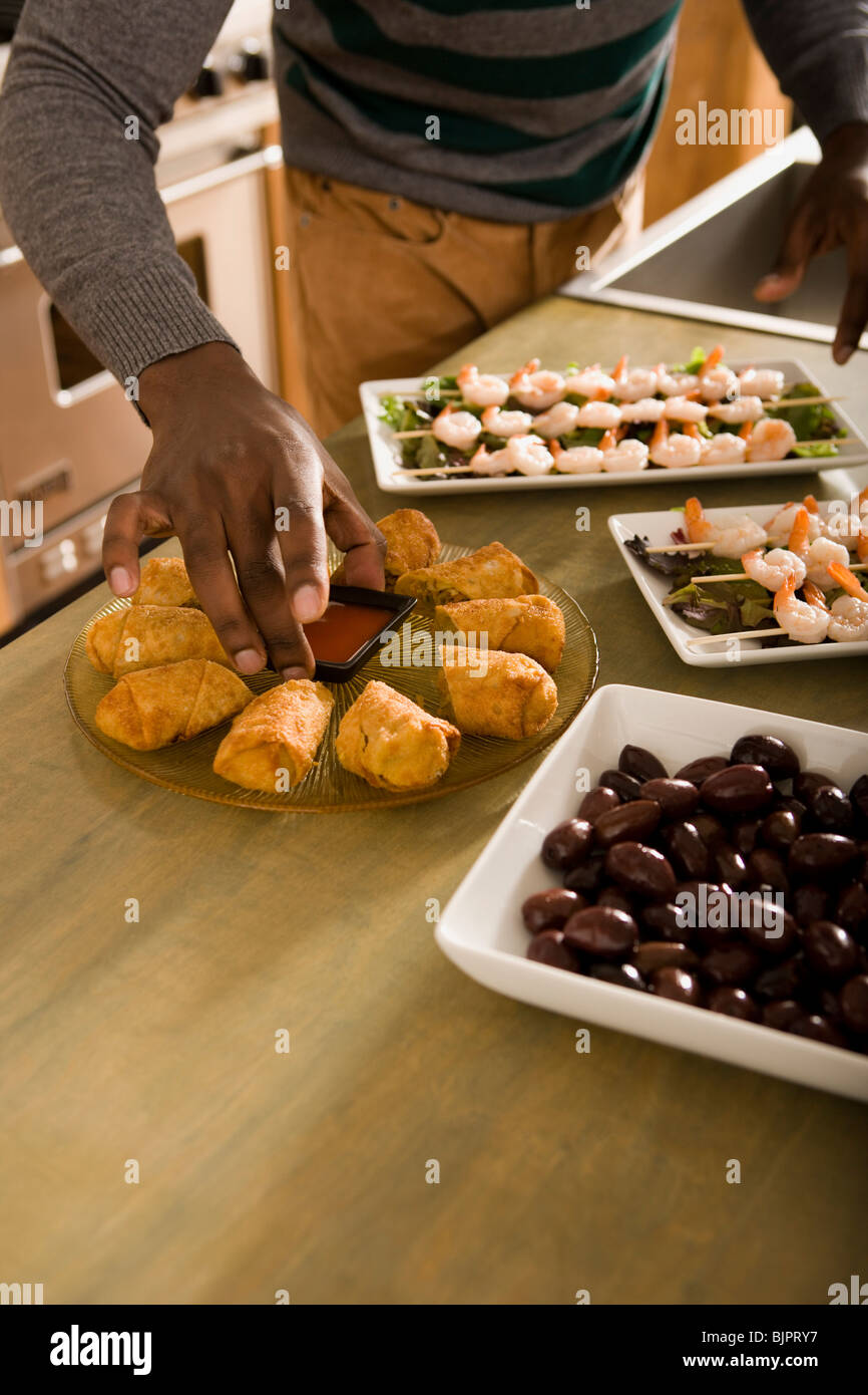Preparing appetizers hi-res stock photography and images - Alamy