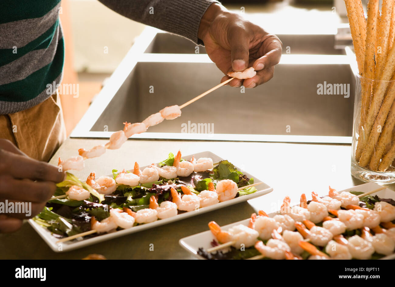 Preparing appetizers hi-res stock photography and images - Alamy