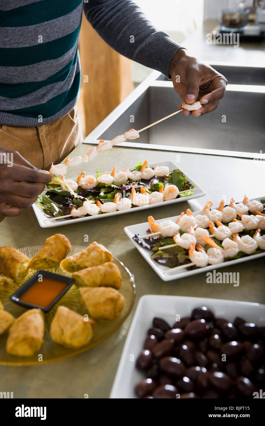 Man preparing appetizers Stock Photo - Alamy