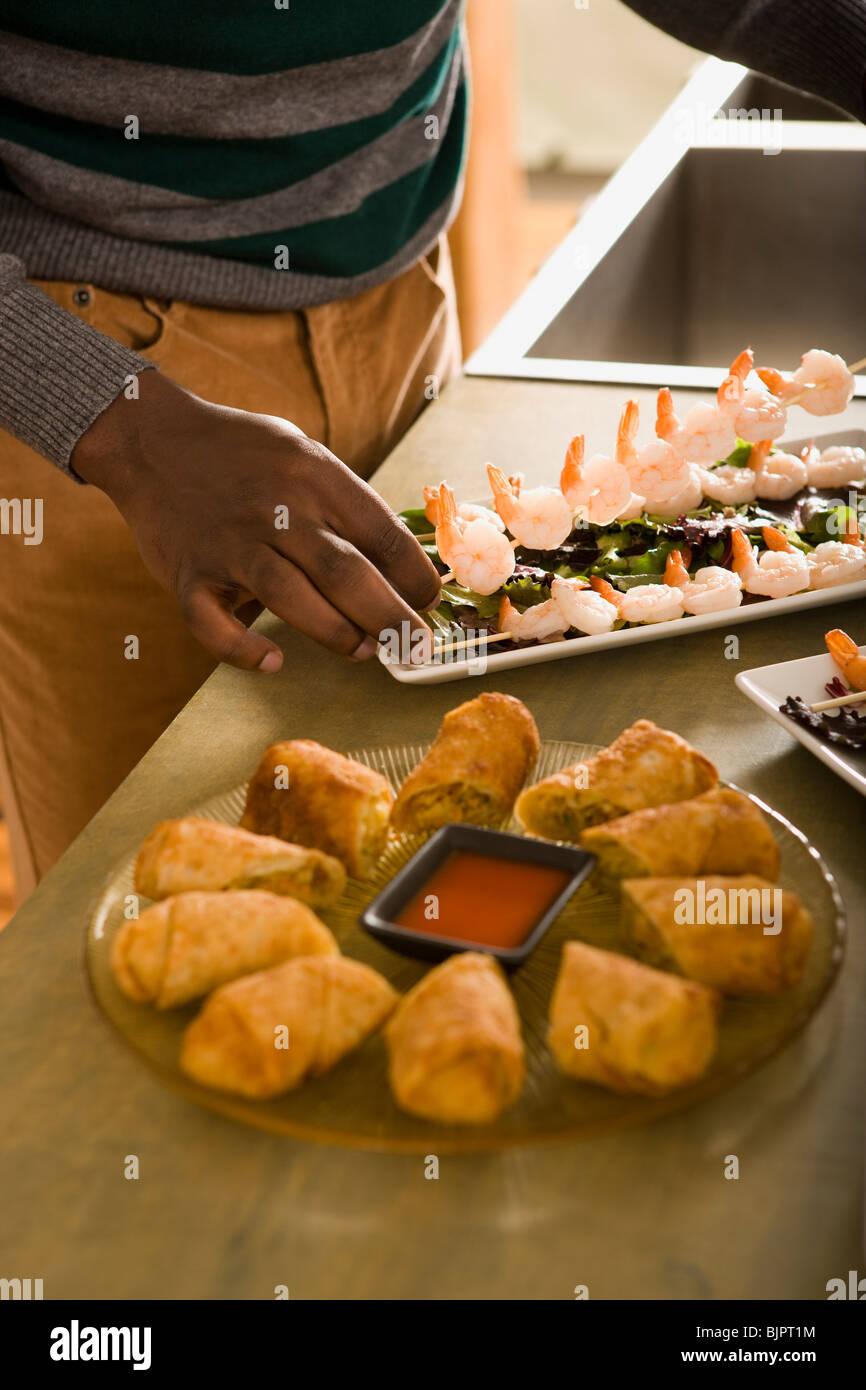 Preparing appetizers hi-res stock photography and images - Alamy