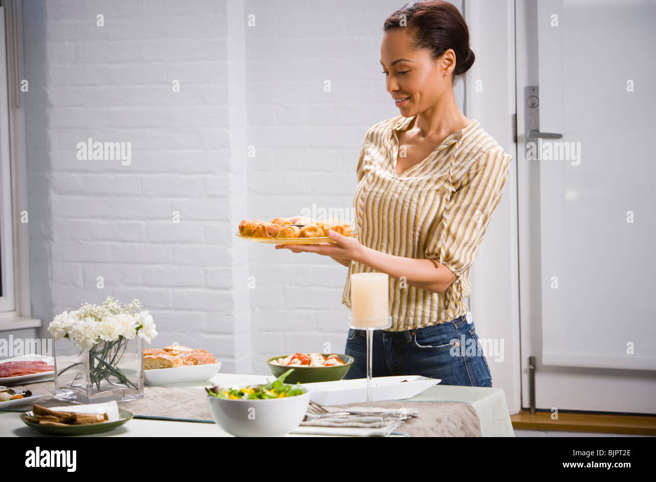 A woman preparing for a party Stock Photo - Alamy