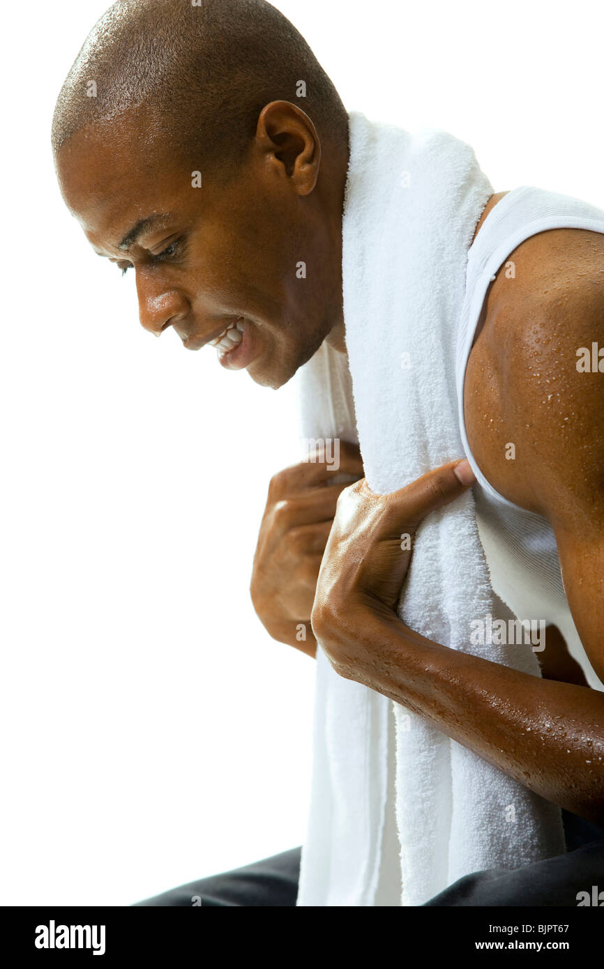 Man sweating with a towel Stock Photo - Alamy