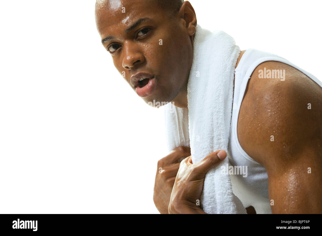 Man sweating with a towel Stock Photo - Alamy