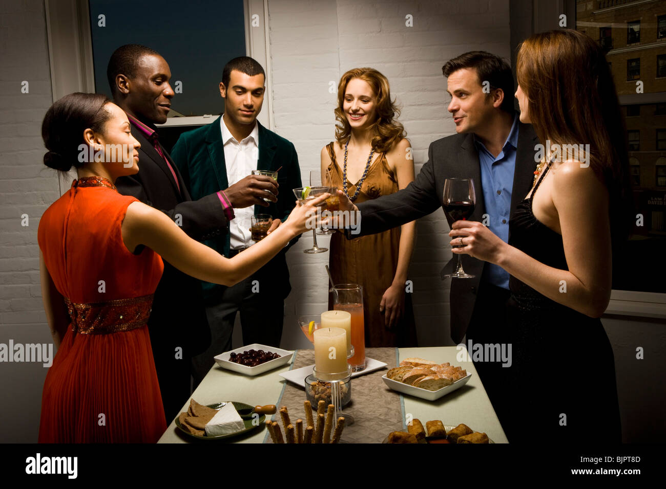 Toasting party goers hi-res stock photography and images - Alamy
