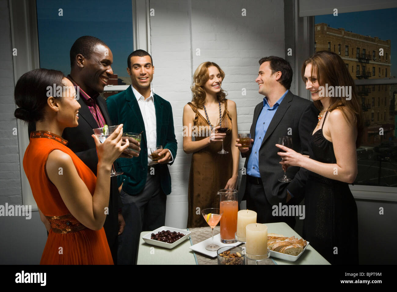 Toasting party goers hi-res stock photography and images - Alamy
