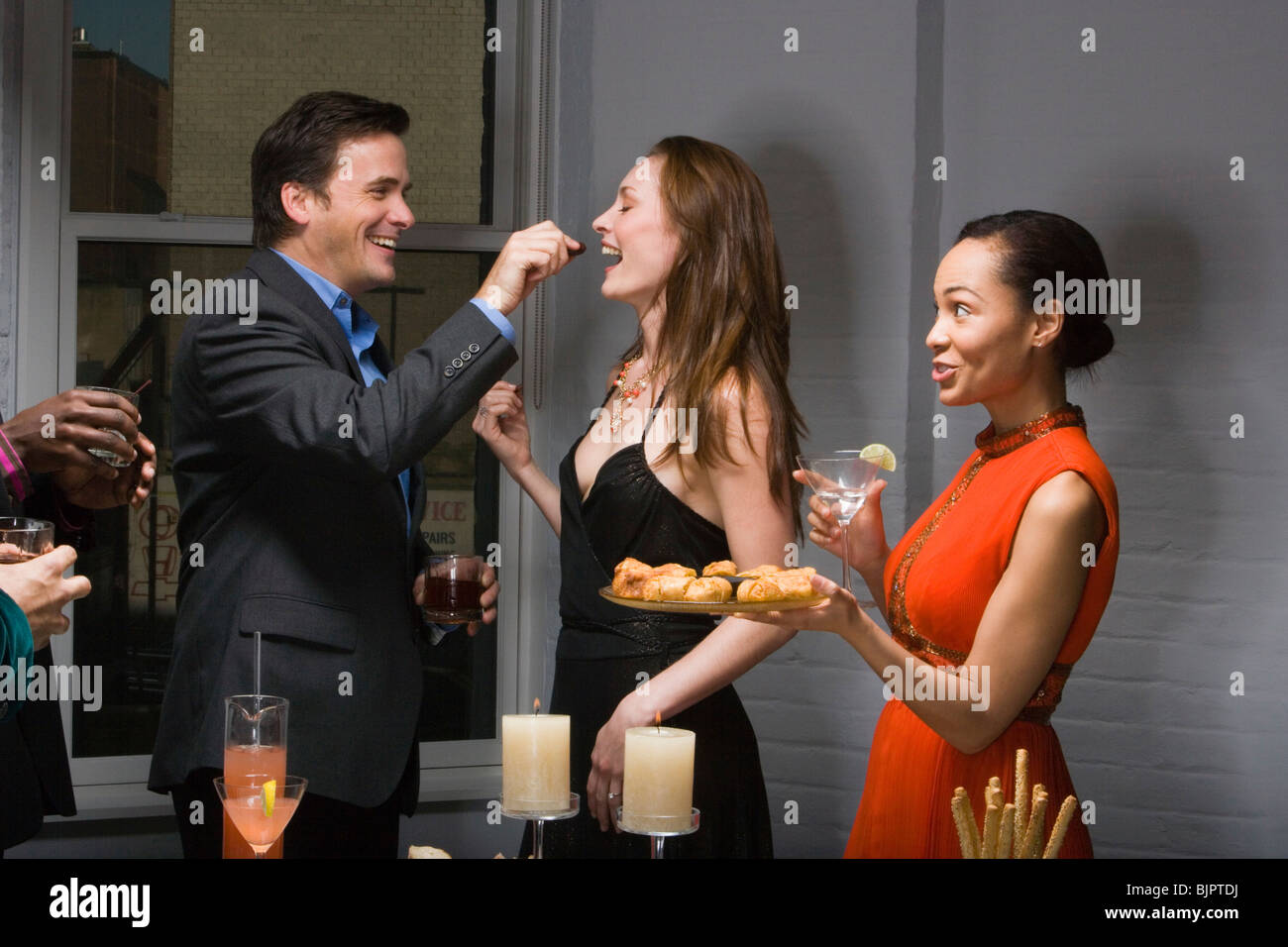 Party goers eat hi-res stock photography and images - Alamy