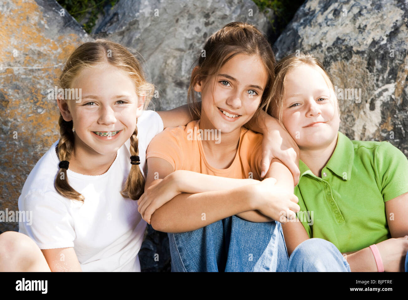 Three girls smiling Stock Photo - Alamy