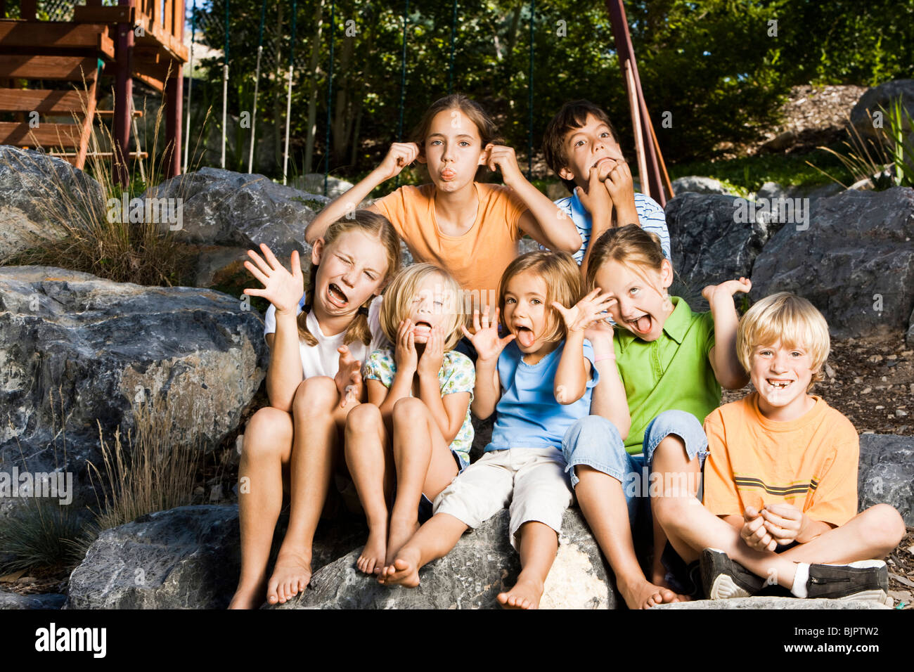 Group of children making funny faces Stock Photo - Alamy
