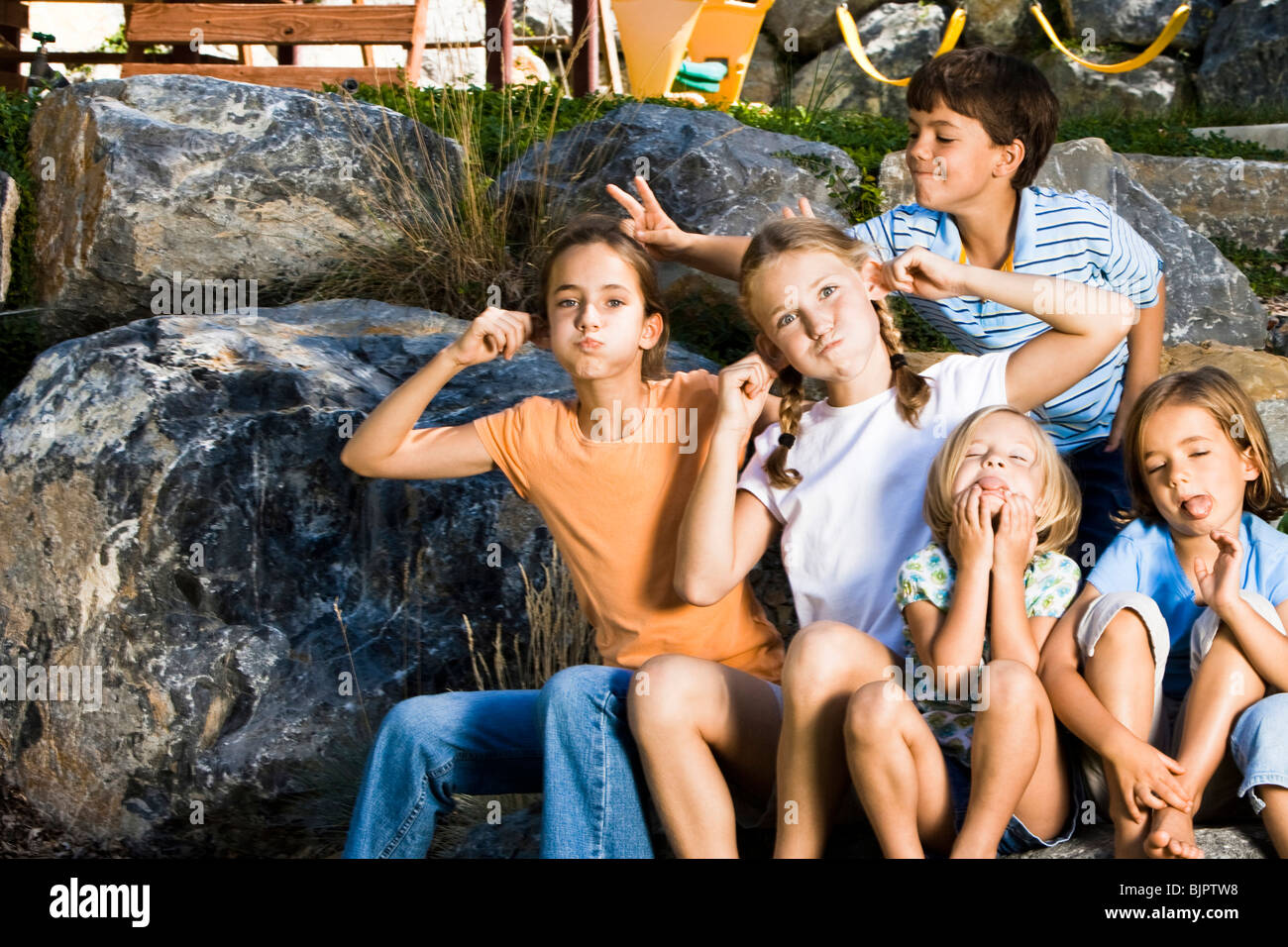 Group of children making funny faces Stock Photo - Alamy