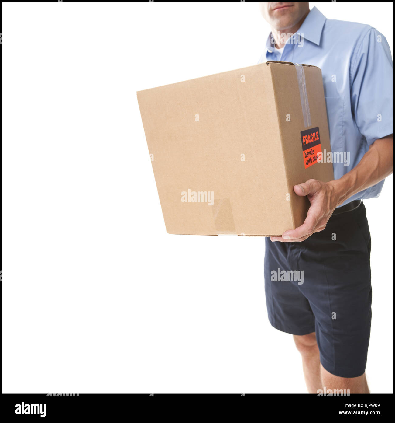 Delivery man with package Stock Photo - Alamy
