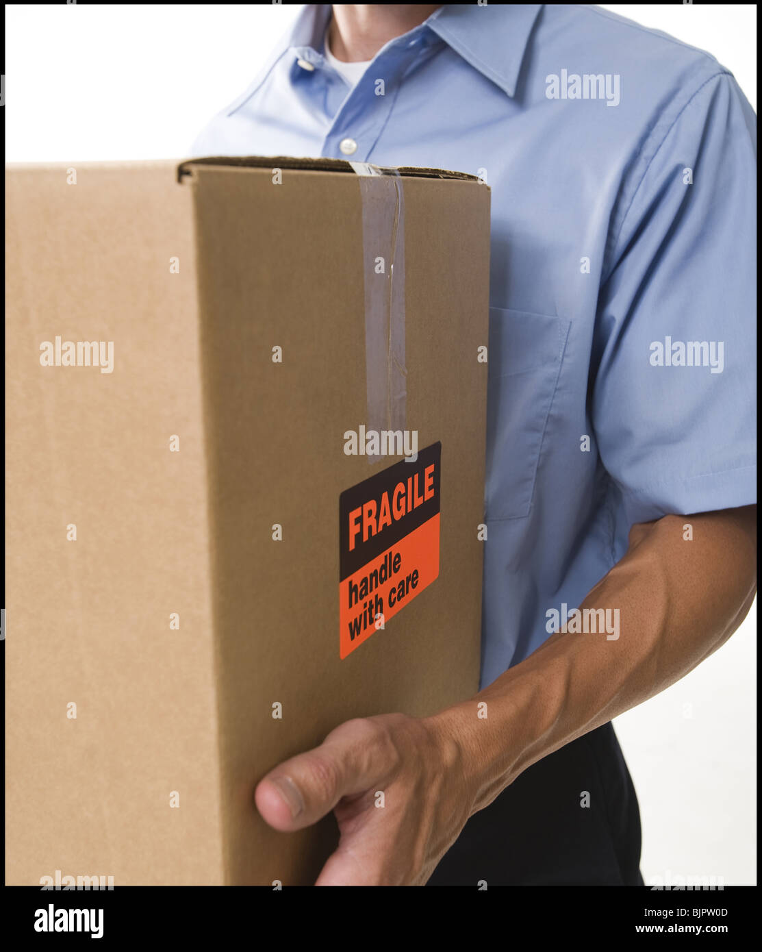Delivery man with package Stock Photo - Alamy