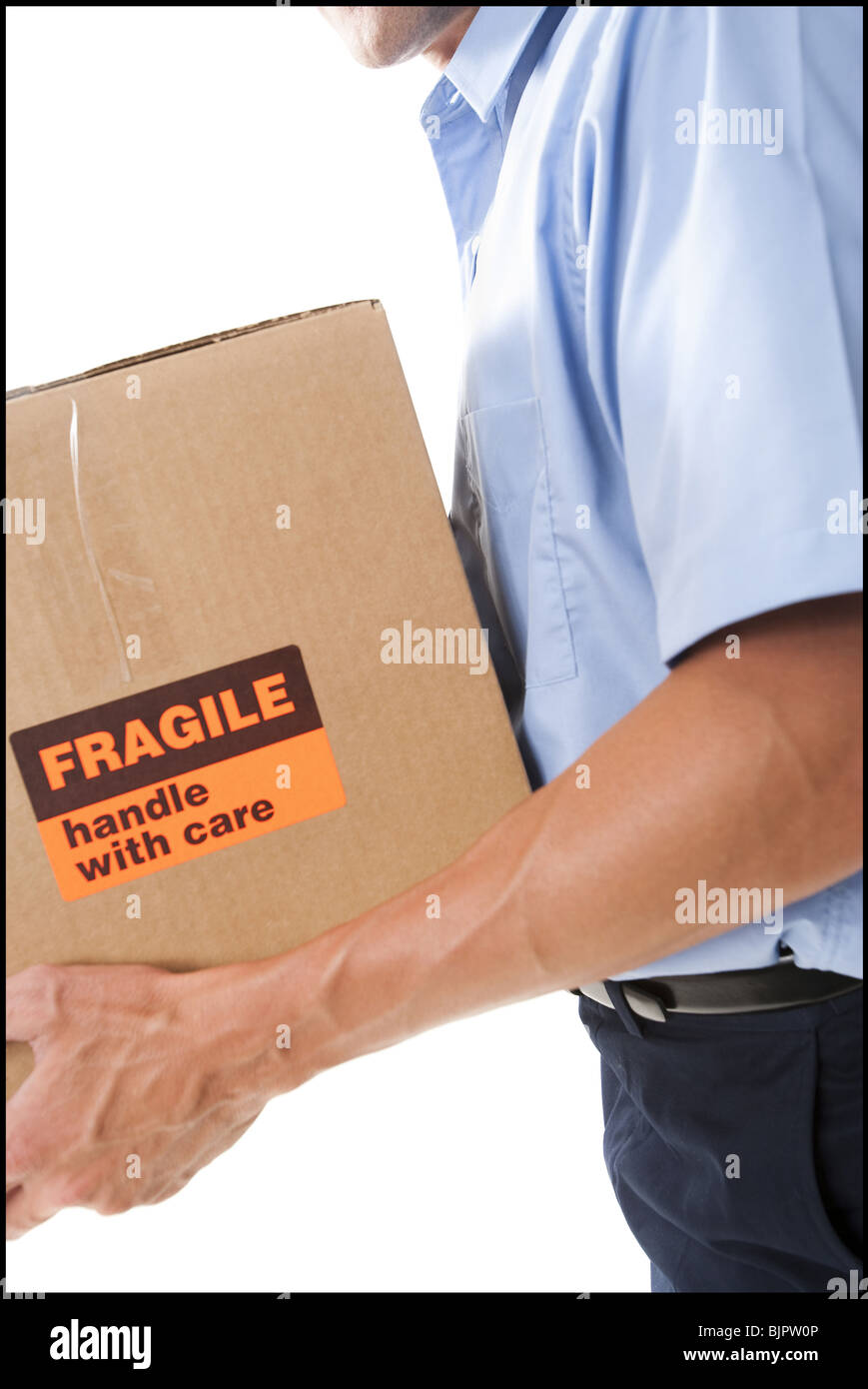 Delivery man with package Stock Photo - Alamy