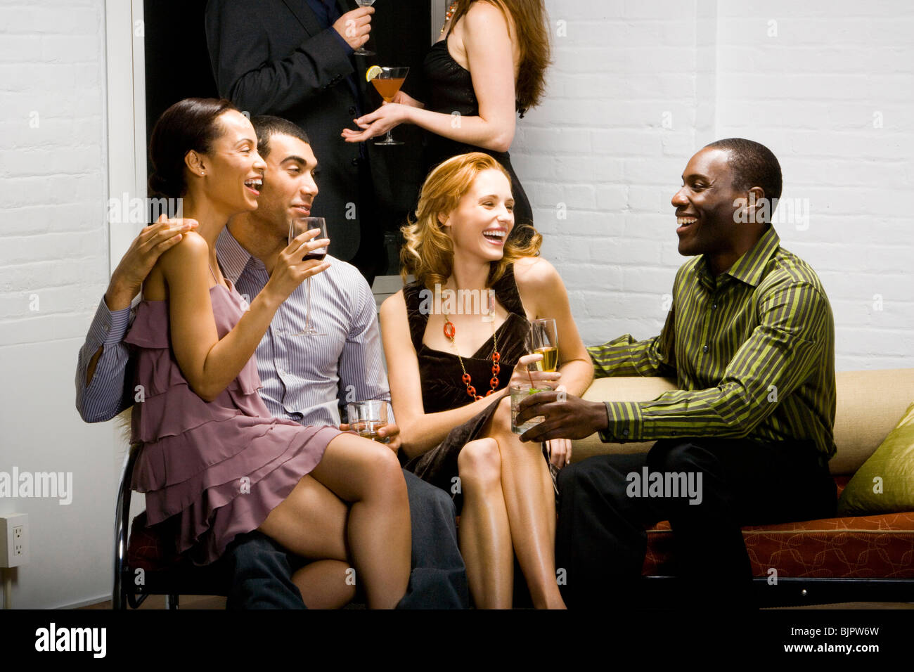 Toasting party goers hi-res stock photography and images - Alamy