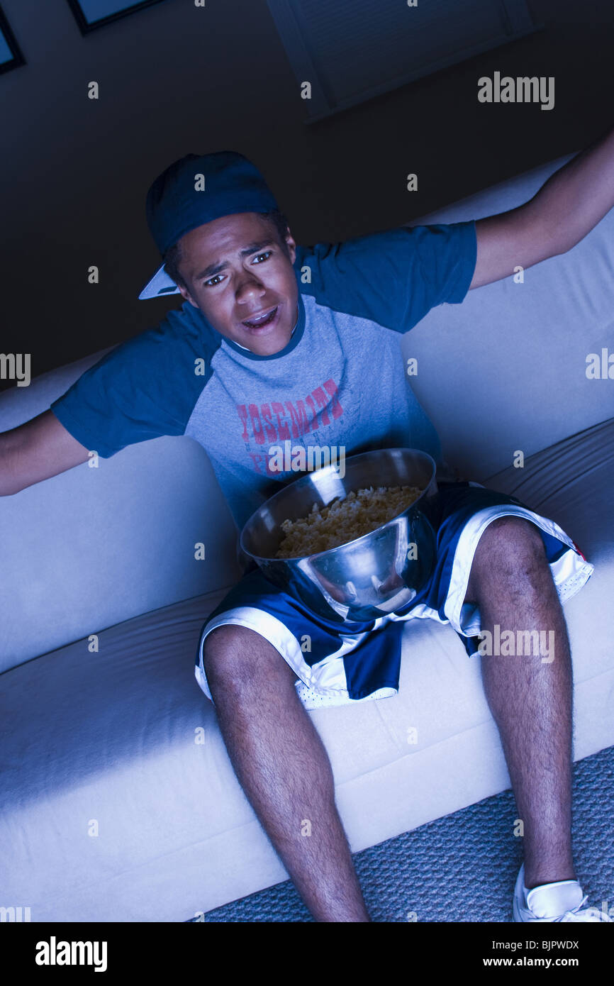 Man watching TV Stock Photo - Alamy