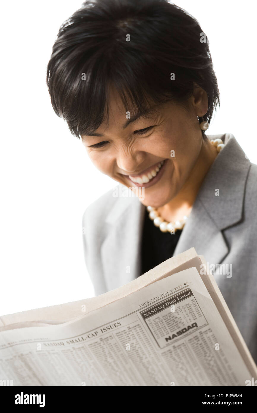 Woman reading the paper Stock Photo - Alamy