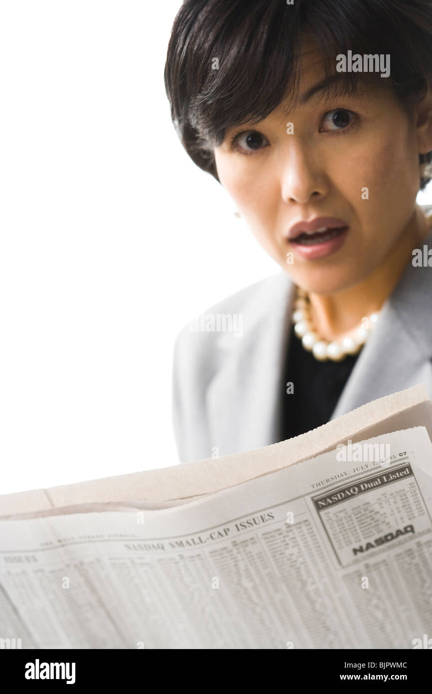 Woman reading the paper Stock Photo - Alamy