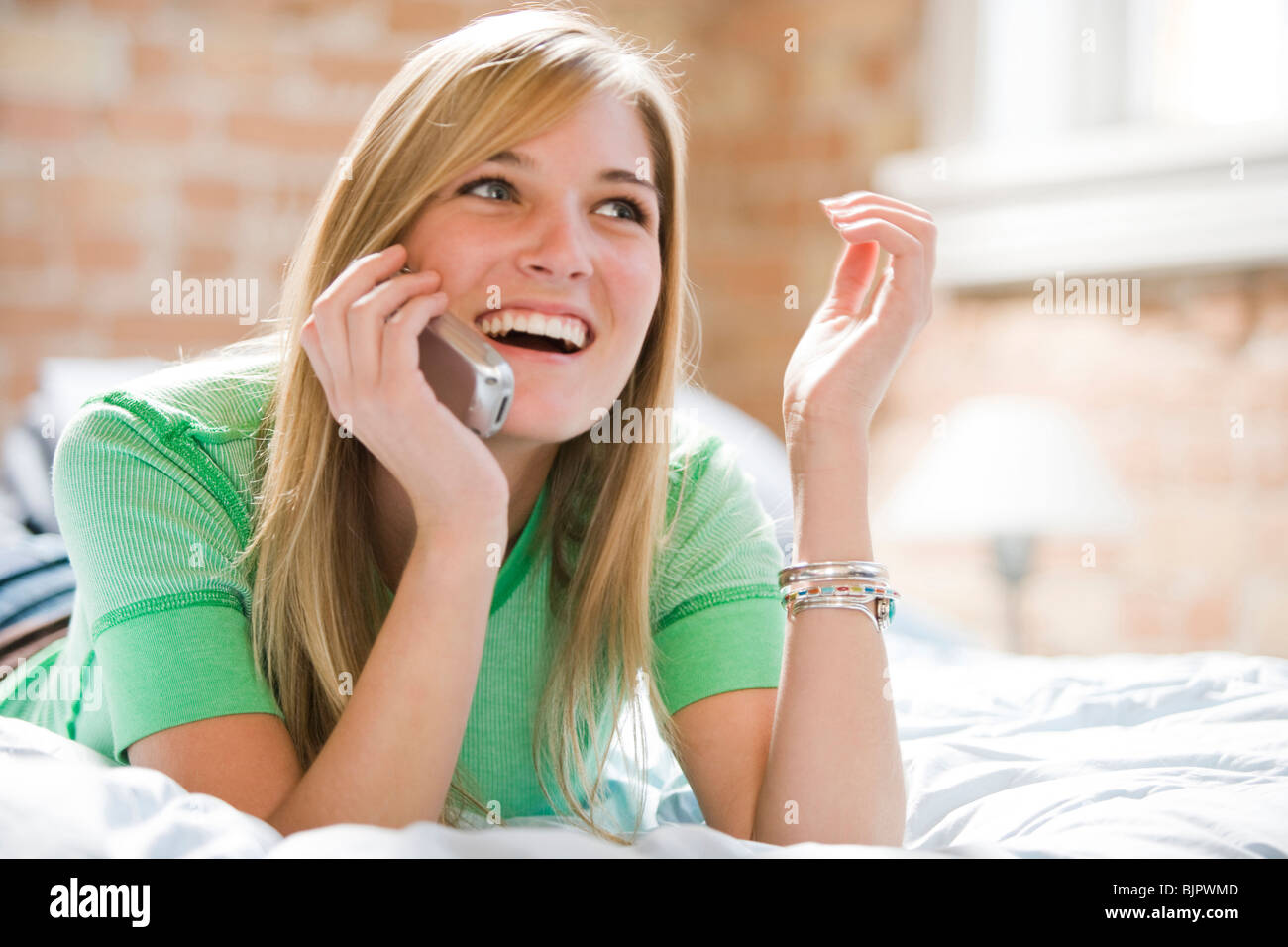 Woman dialing cell phone Stock Photo - Alamy