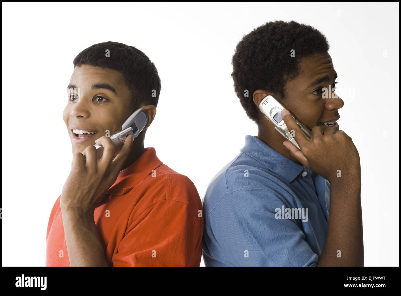 Two men on cell phones Stock Photo - Alamy