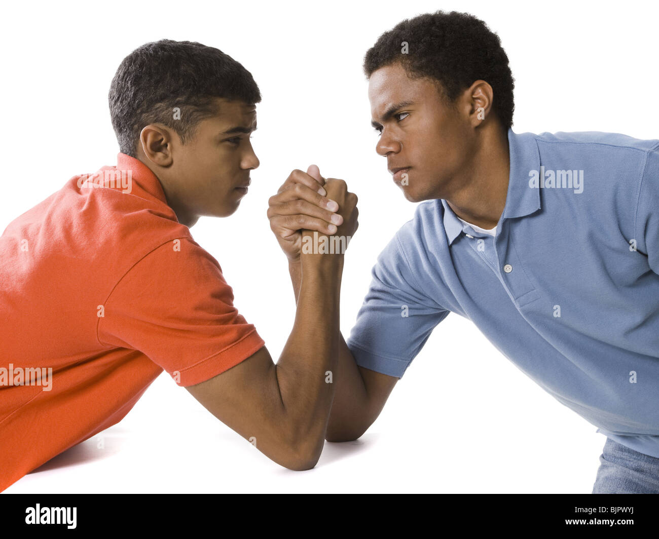 Two male friends arm wrestling Stock Photo - Alamy