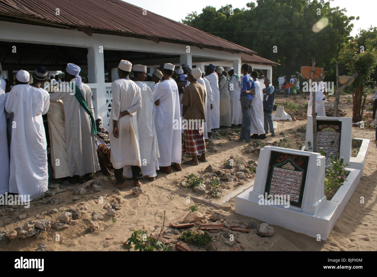 Pilgrims visit the Islamic cemetery to see the mausoleum of Sharif ...