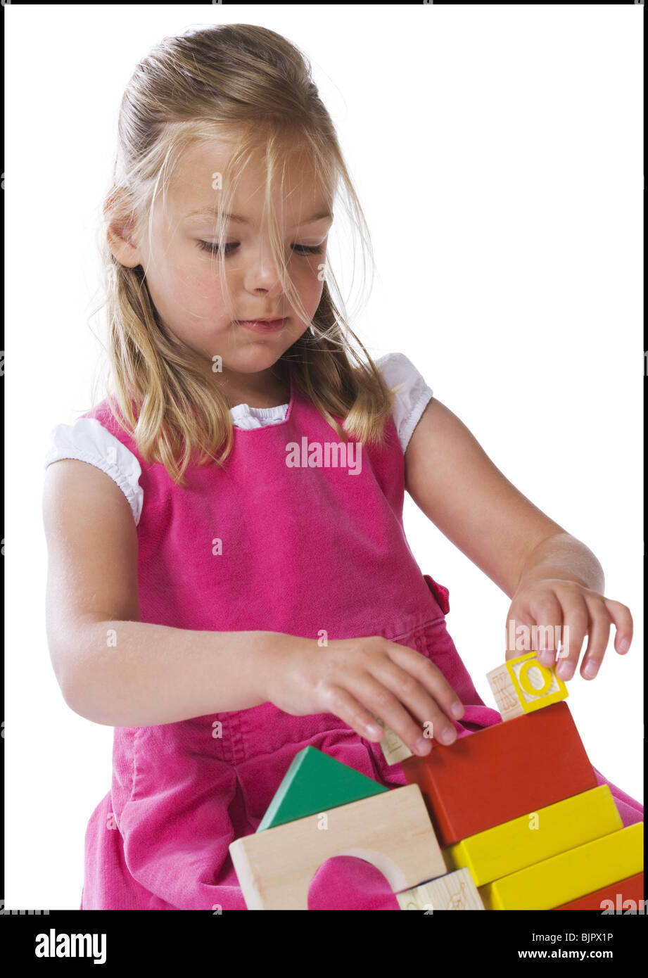 Girl playing with blocks Stock Photo - Alamy