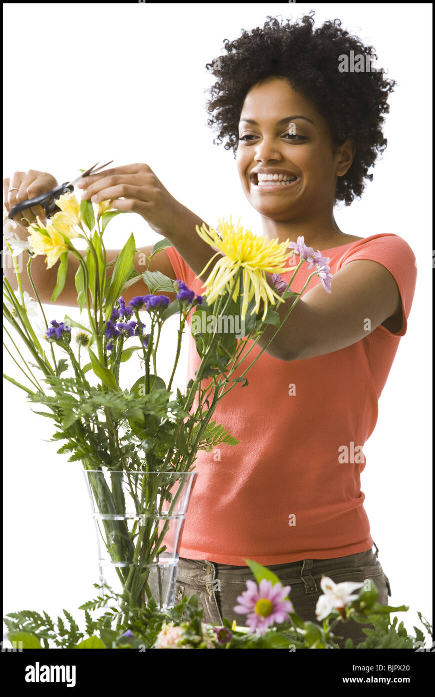 Adult woman female worker arranging flowers hi-res stock photography ...