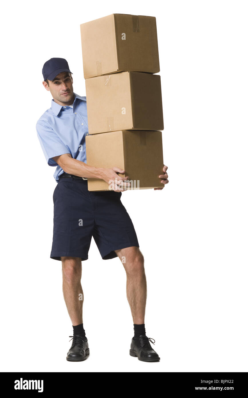 Delivery man with package Stock Photo - Alamy