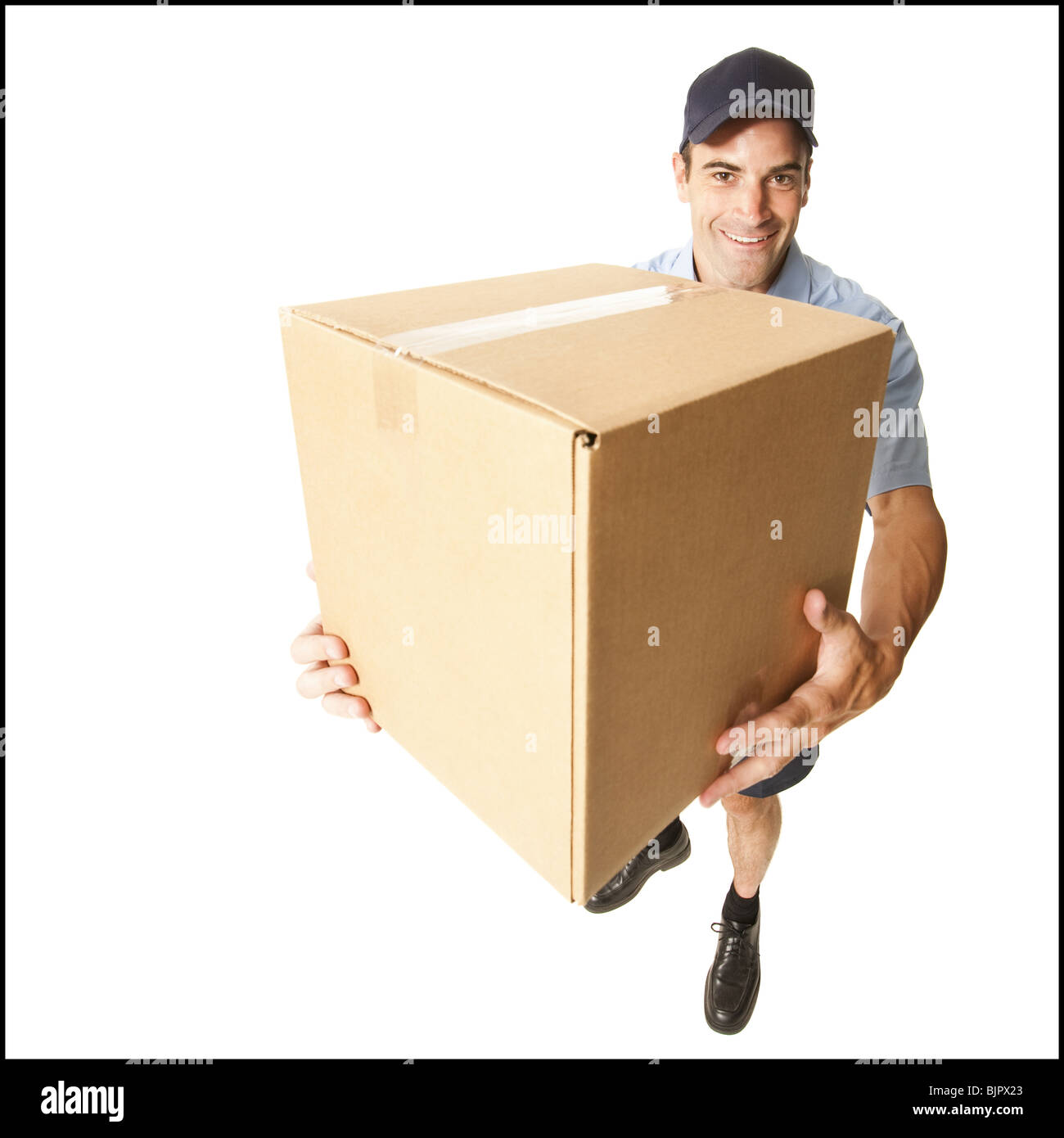 Delivery man with package Stock Photo - Alamy