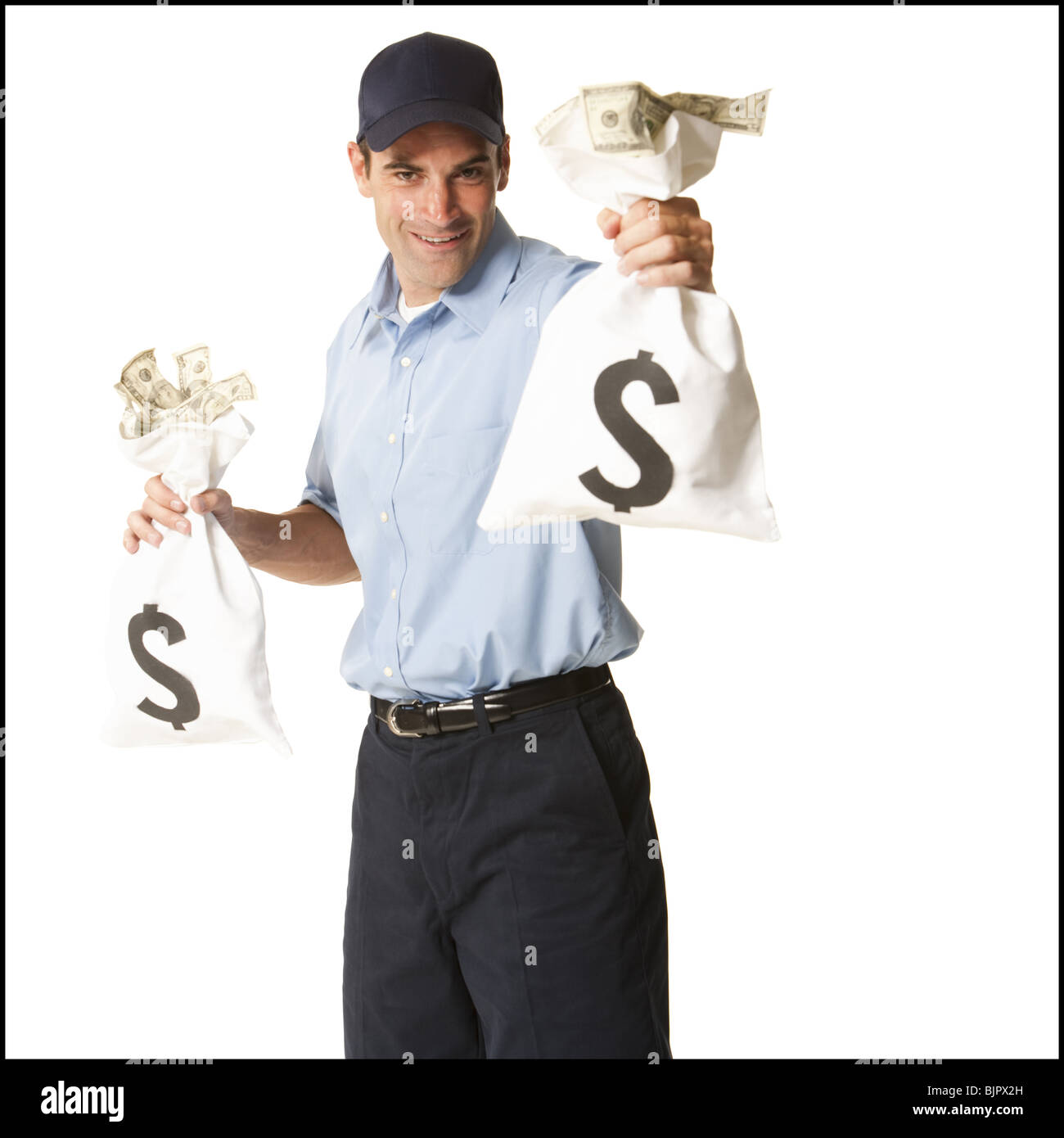 Man holding money bags Stock Photo - Alamy