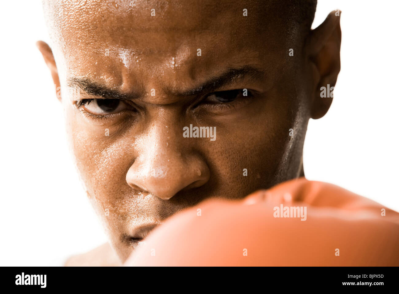 Man in boxing gloves sweating Stock Photo - Alamy