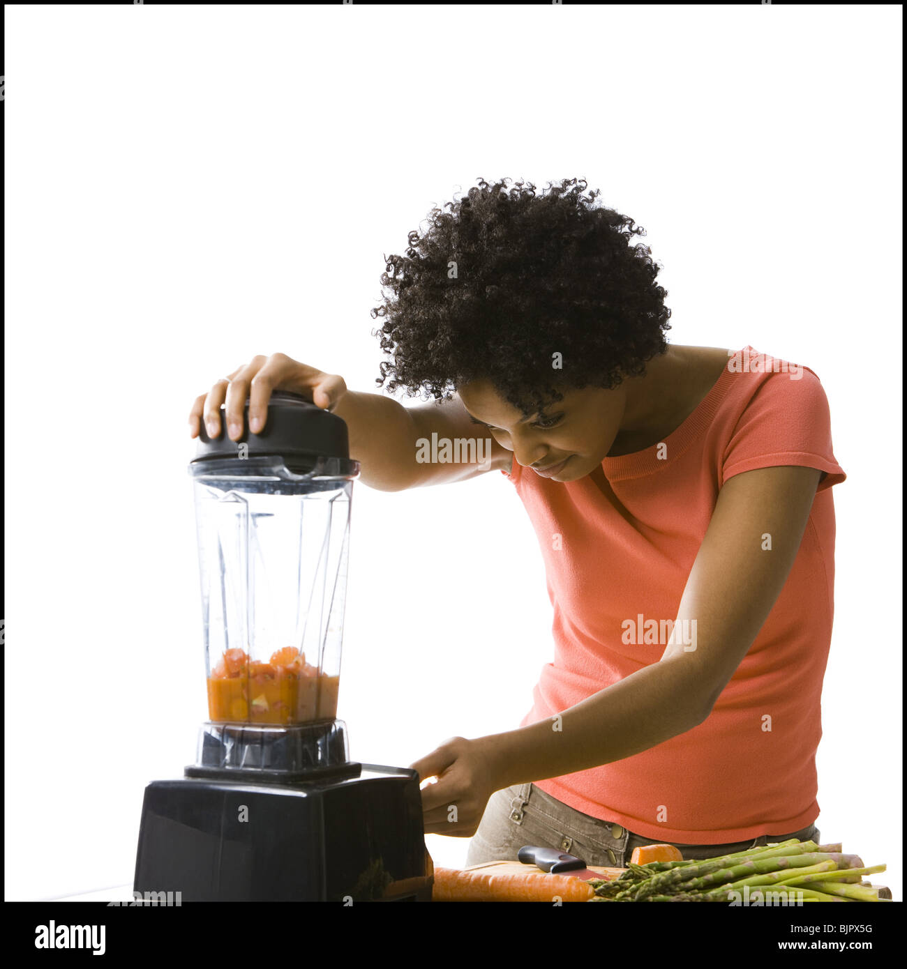 Woman using a blender Stock Photo - Alamy