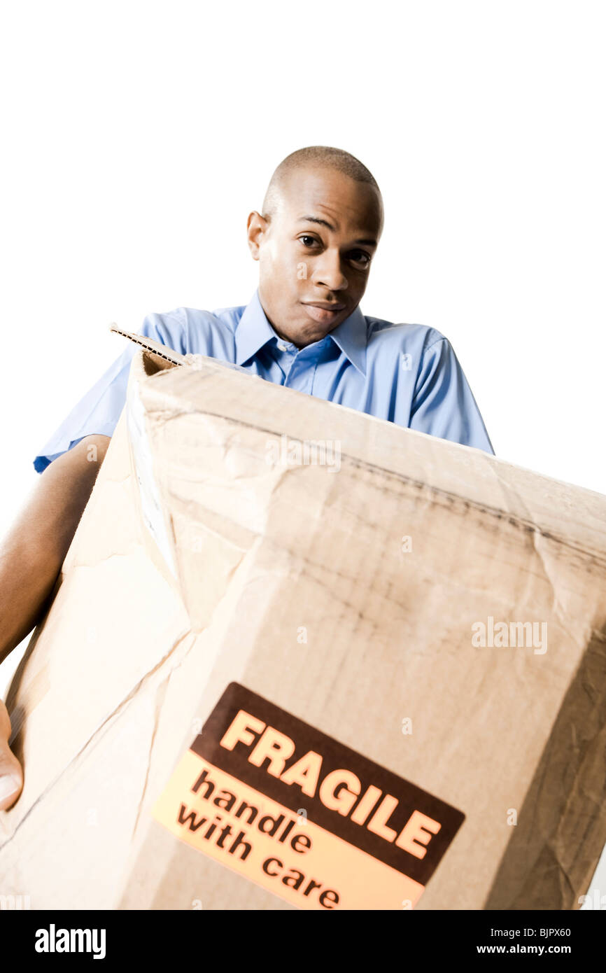 Delivery man with damaged package Stock Photo - Alamy