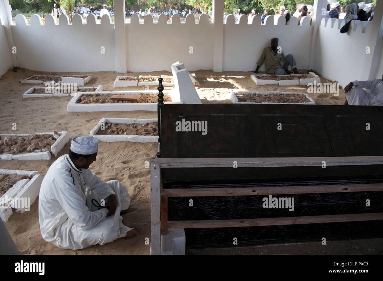 Pilgrims visit the Islamic cemetery to see the mausoleum of Sharif ...