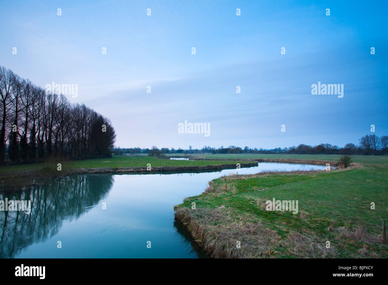 Dawn breaks over the meadows of the Upper Thames near Lechlade in ...