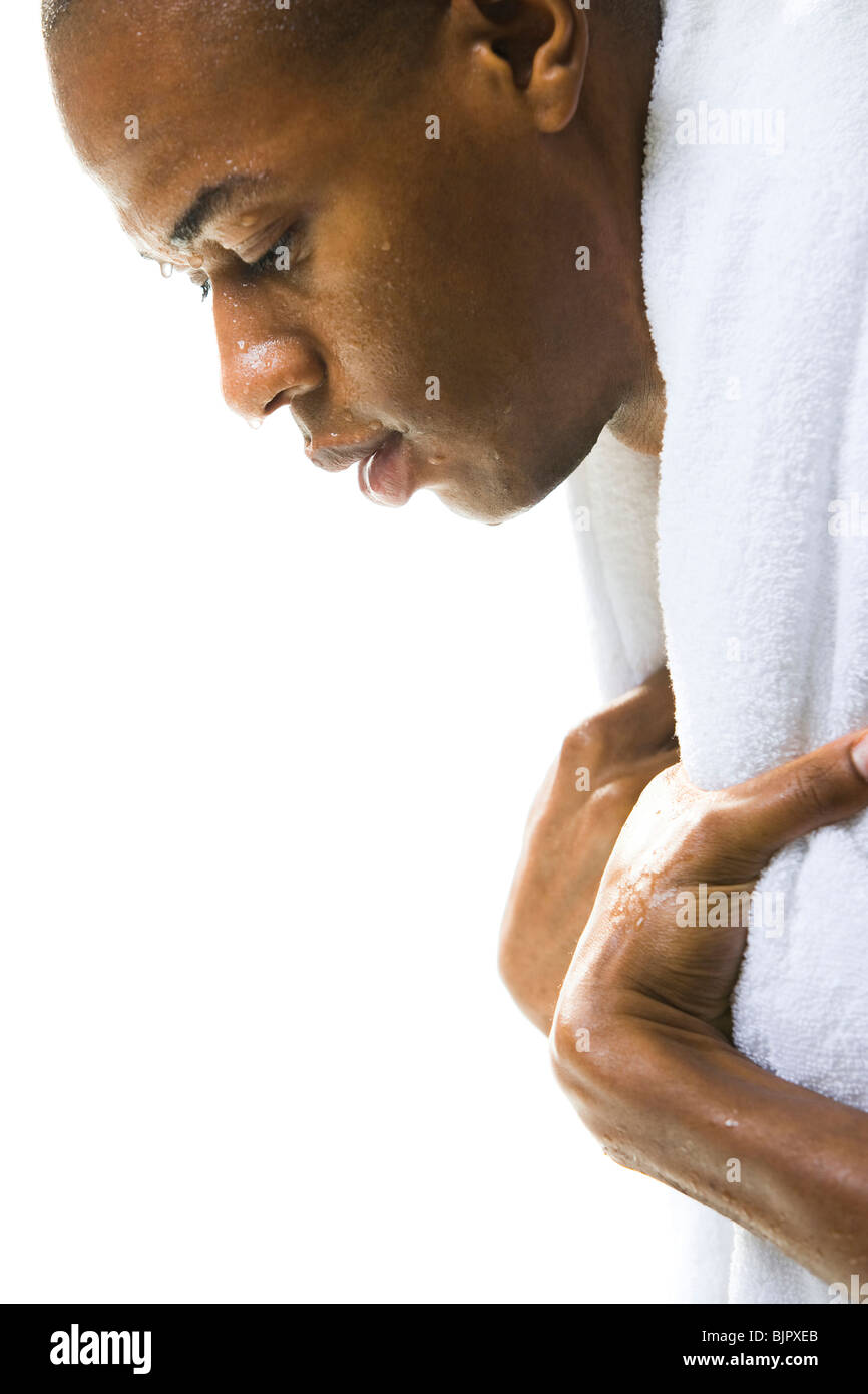 Man sweating with a towel Stock Photo - Alamy