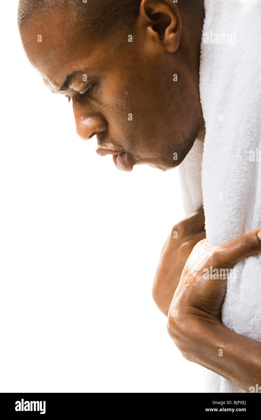 Man sweating with a towel Stock Photo - Alamy