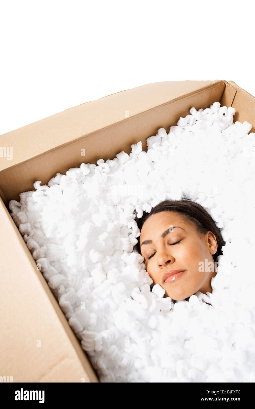 Woman smiling in a cardboard box Stock Photo - Alamy