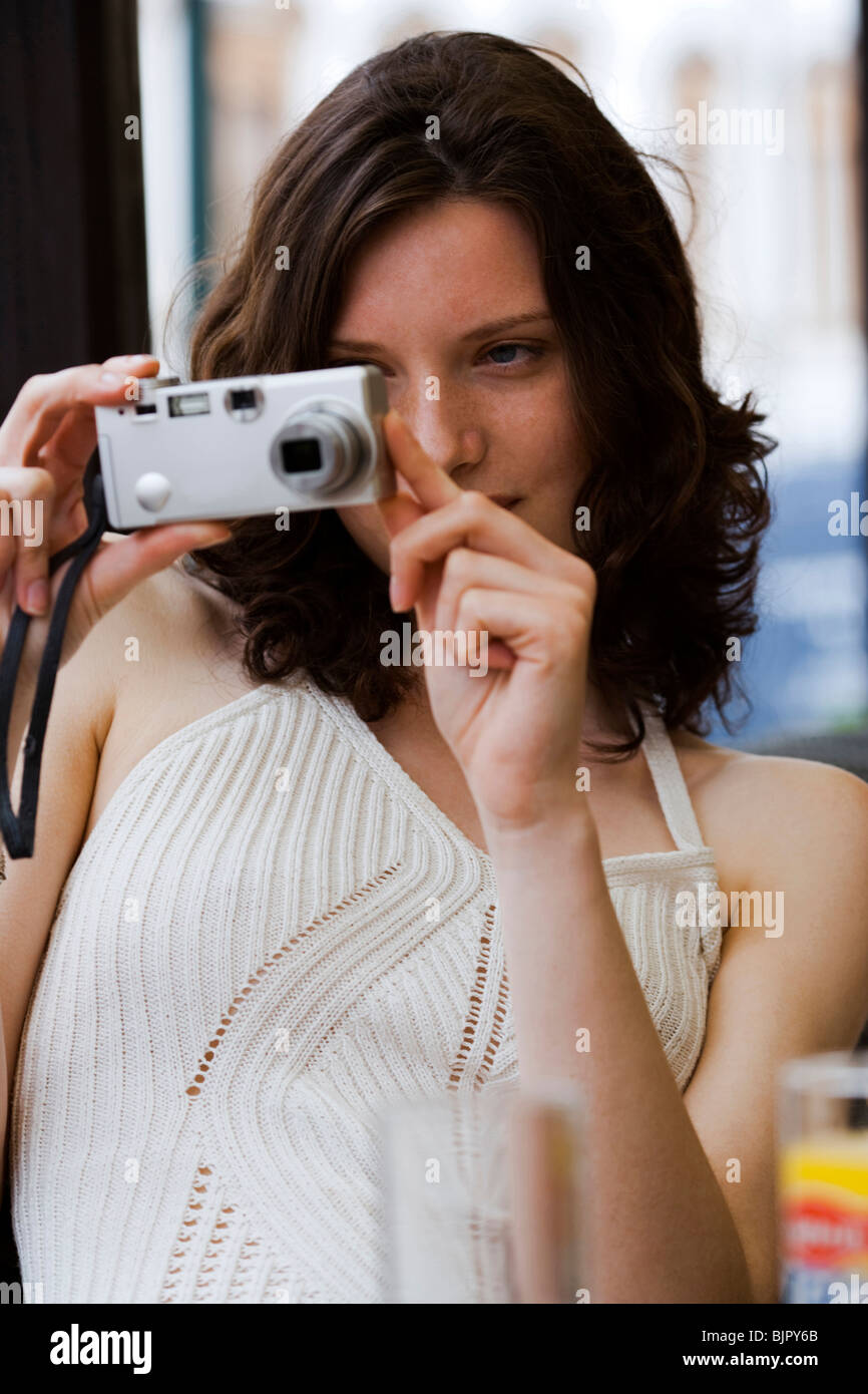 Woman taking a picture Stock Photo - Alamy