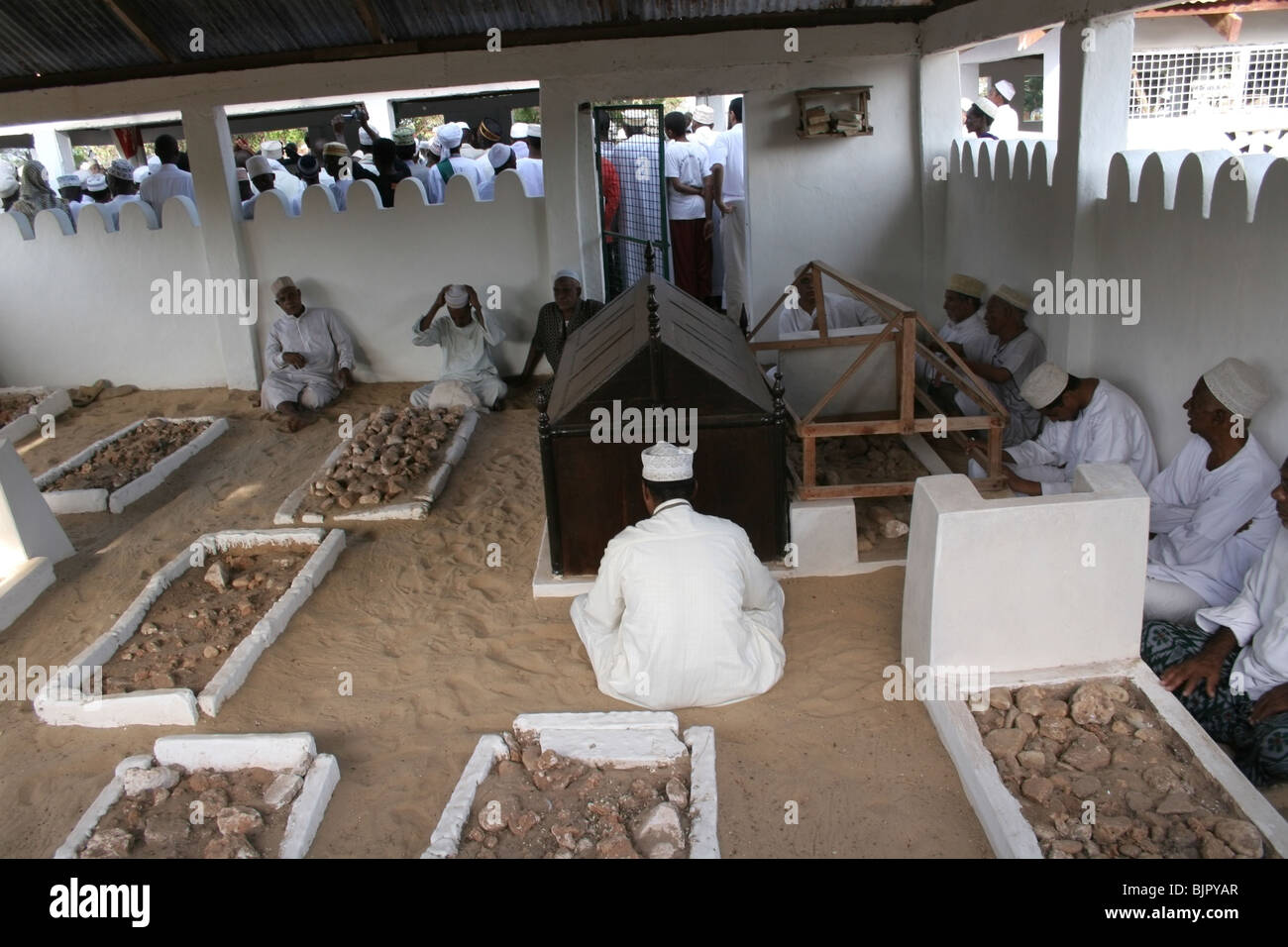 Pilgrims visit the Islamic cemetery to see the mausoleum of Sharif ...