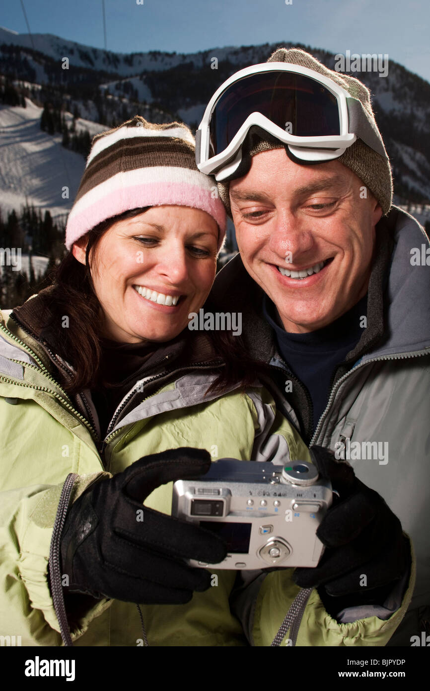 Couple using a camera outside Stock Photo - Alamy